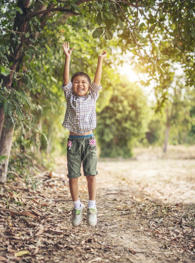 Happy boy playing alone stock image. Image of beautiful - 167796275