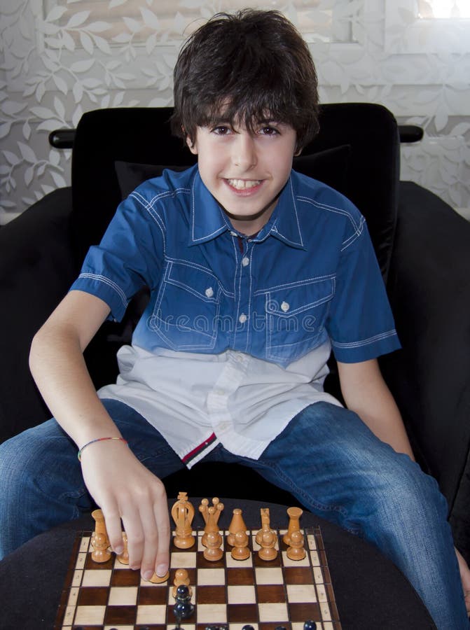 Happy Boy is Playing Chess stock image. Image of face - 52751555