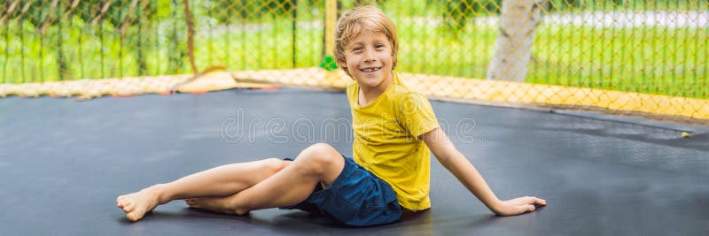 Happy Boy Plays Outdoors in Garden Jumping High in the Sky on ...