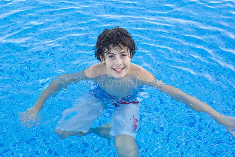 Happy boy in the pool stock image. Image of swimming - 59757421