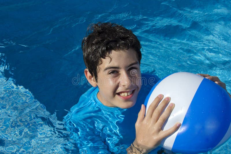 Happy boy in the pool stock image. Image of sunny, blue - 75272613