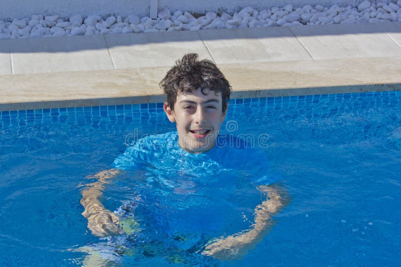 Happy boy in the pool stock photo. Image of summer, teen - 75272722