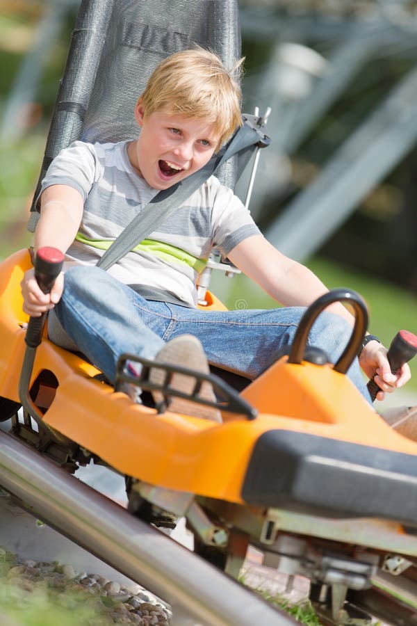 Happy Boy Riding at Bobsled Coaster Rail Trac Stock Image - Image of ...