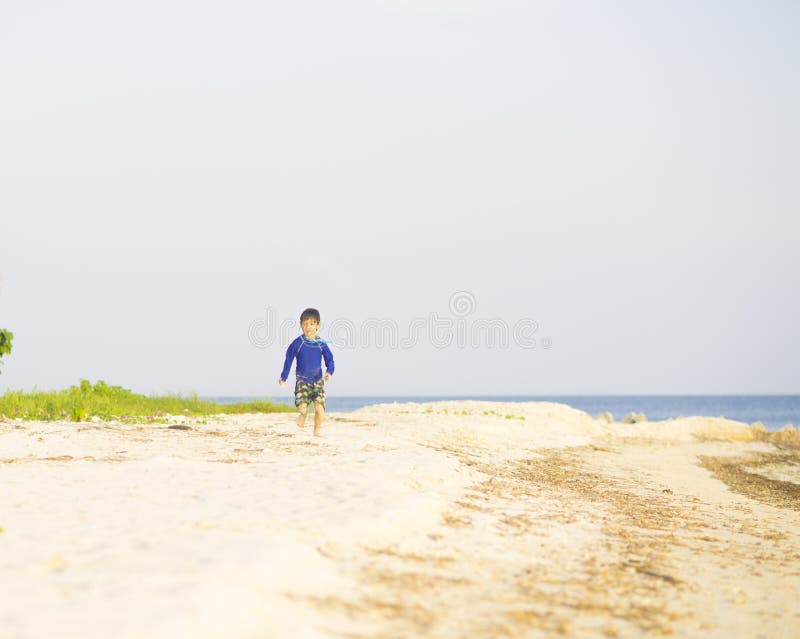 Happy Boy Running on the Beach Stock Image - Image of caucasian, family ...