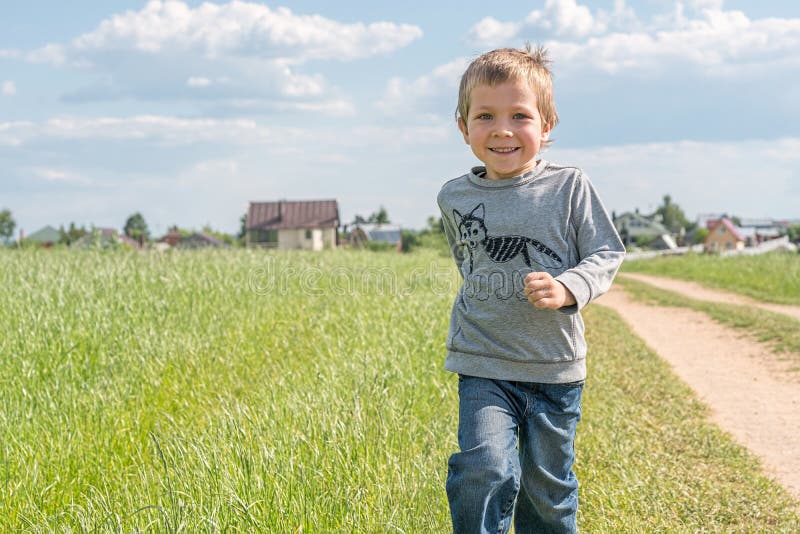 Happy Boy Running on the Field Stock Image - Image of landscape ...