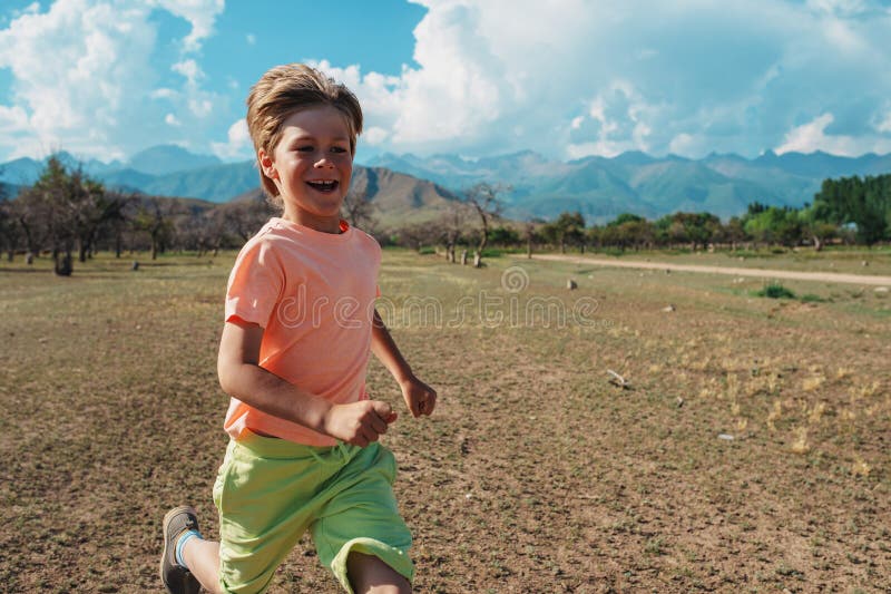 Boy Running Fast on Mountains and Meadow with Farm Animals Background ...