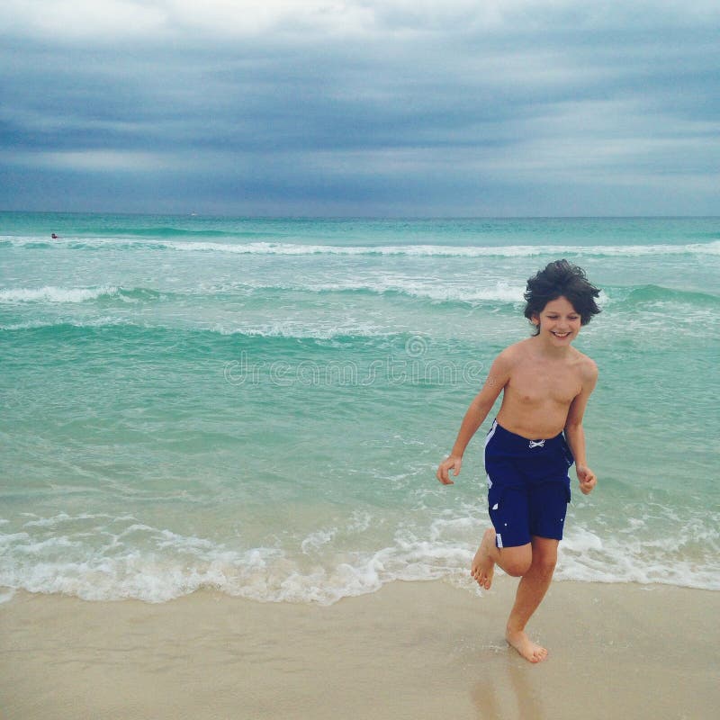 Happy Boy Running at the Ocean Beach Stock Image - Image of ocean ...