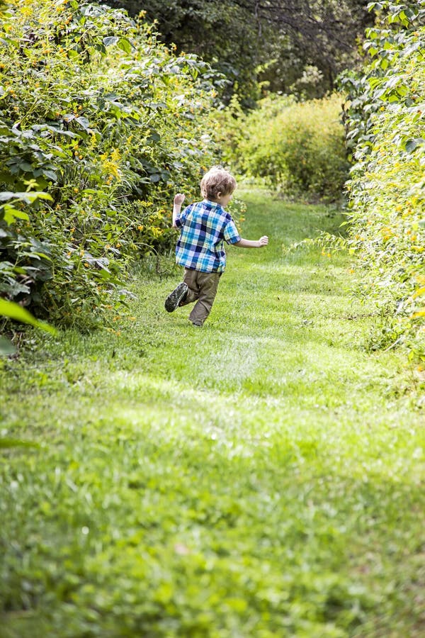 Happy boy running outside stock image. Image of spring - 77780363