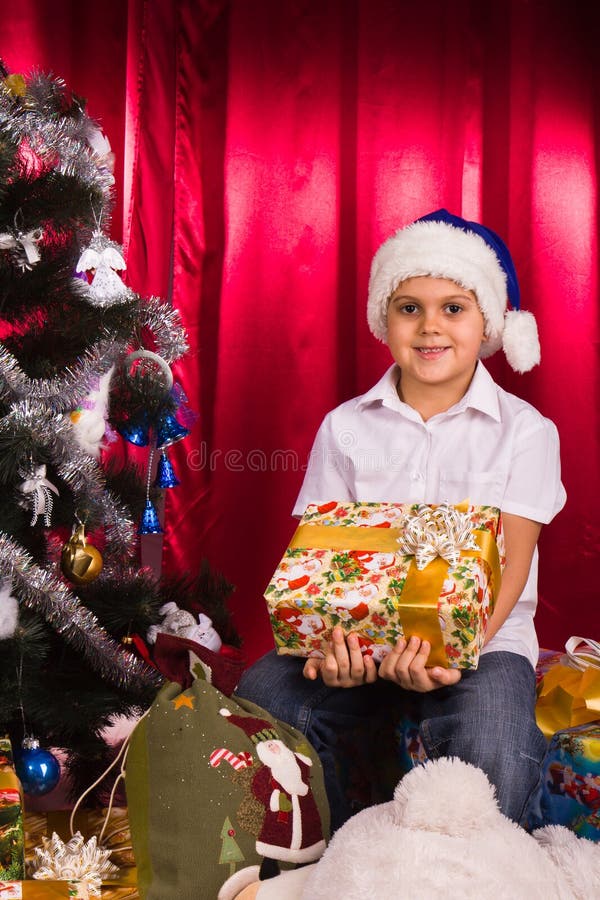 Happy boy in Santa s hat stock image. Image of celebration - 27834395