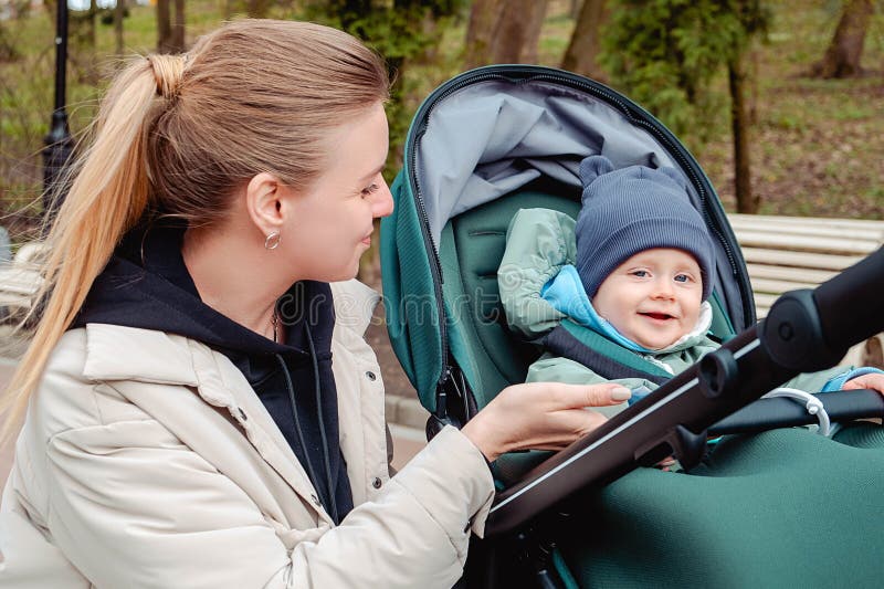 Happy Boy Sitting in a Stroller with Mom Stock Image - Image of love ...