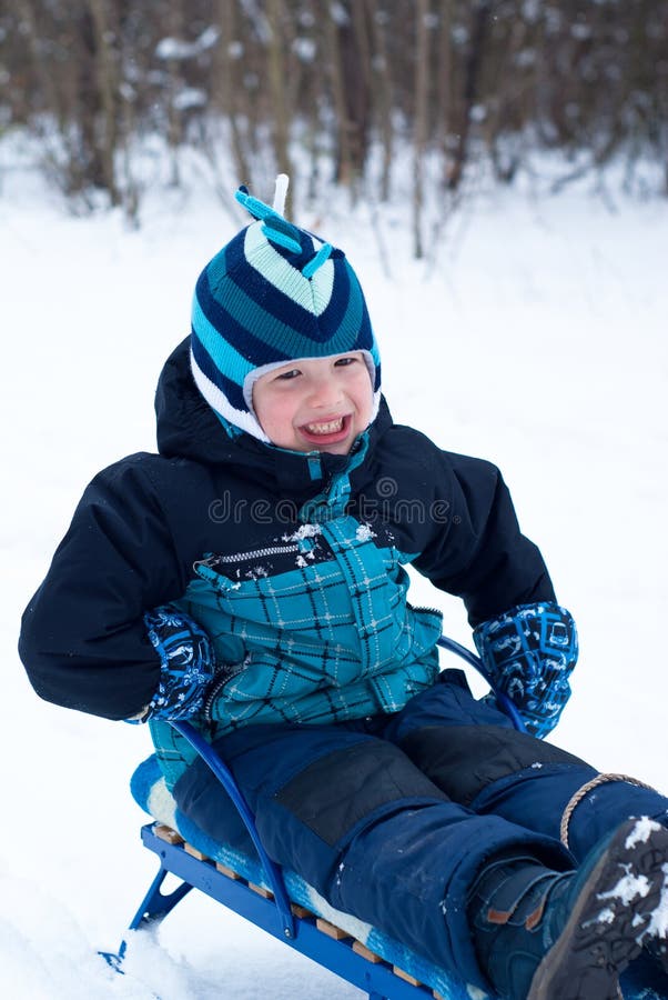 Happy boy sledding stock image. Image of holiday, healthy - 50092769
