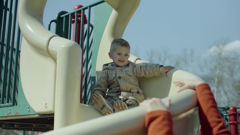 Happy Boy Sliding Upside Down in Playground. 4k Stock Footage - Video ...