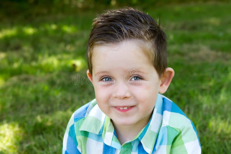 Happy Boy Smiling in a Field Stock Photo - Image of grass, natural ...