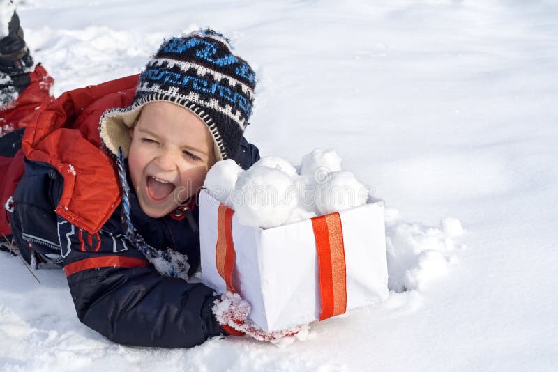Happy Boy in the Snow with a Box of Snowballs Stock Photo - Image of ...