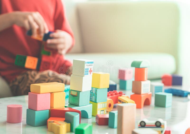 Boy Stacking Toy Blocks on a Living Room for Educational Toy Stock ...