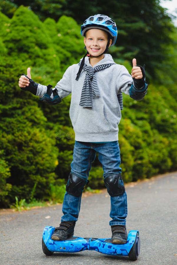 Happy Boy Standing on Hoverboard or Gyroscooter Outdoor Stock Image ...