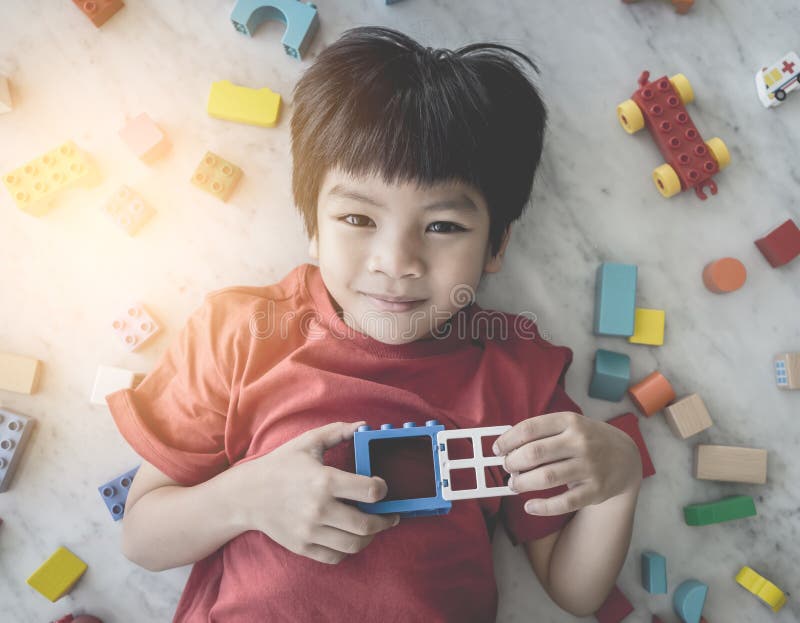 Boy Surrounded by Colorful Toy Blocks with Open Heart Windows Stock ...