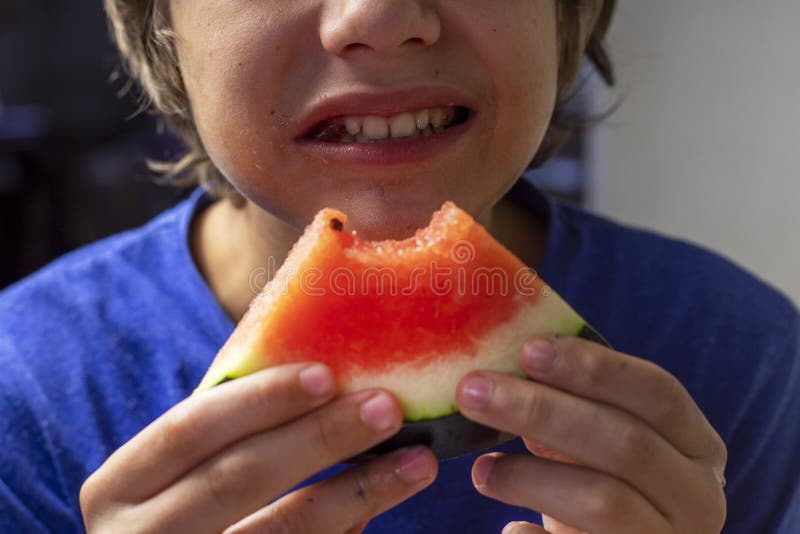 Happy Boy Took a Bite of Red Watermelon from the Slice. Stock Image ...