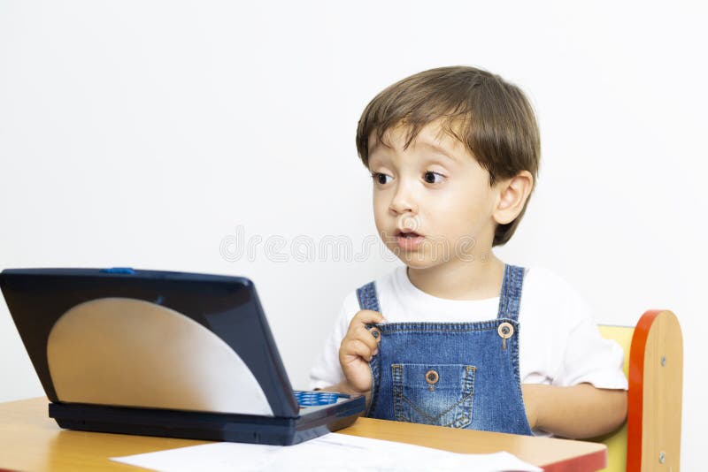 Happy Boy using laptop stock photo. Image of people - 149001428