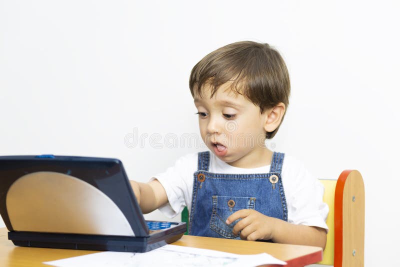 Happy Boy using laptop stock photo. Image of latin, caucasian - 149001450