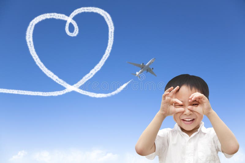 Happy Boy Watching Airplane Flying and Drawing a Heart of Cloud Stock ...