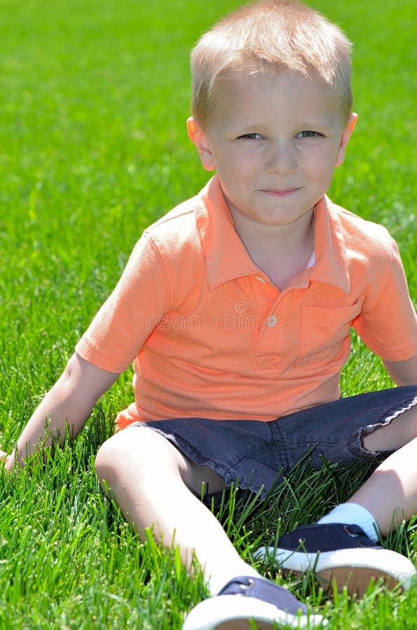 Happy boy stock photo. Image of little, sitting, grass - 60339892