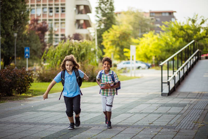 Happy Boys with Backpack Going To Home Together Stock Photo - Image of ...