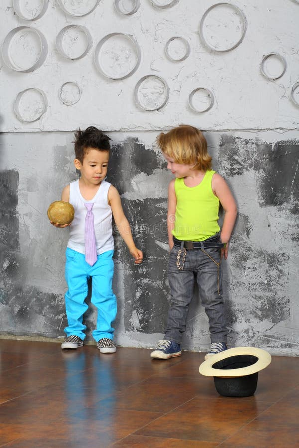 Happy Boys Throw a Ball in a Hat Stock Photo - Image of person, small ...