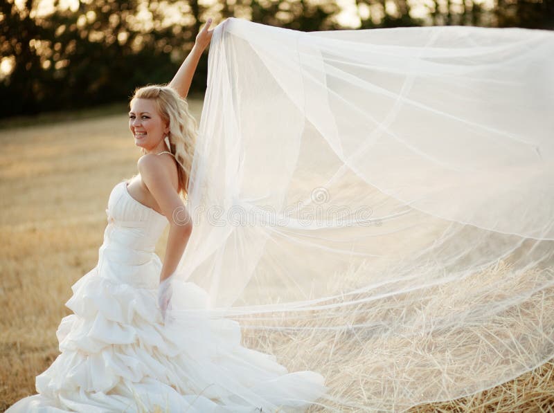 Bride jumping on beach. stock image. Image of vertical - 2045881
