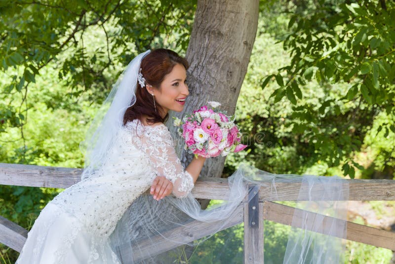 Happy bride in garden stock photo. Image of laughing - 94097812