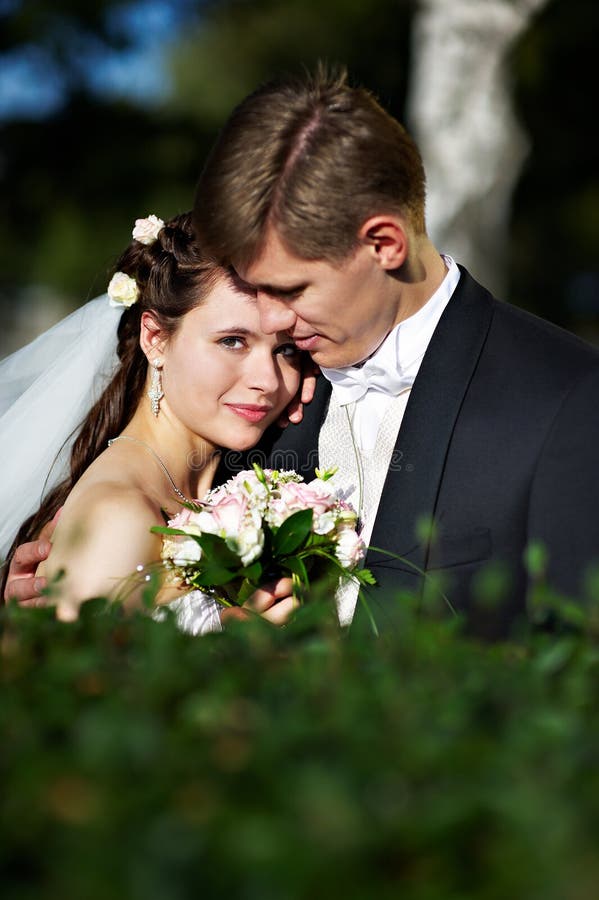 Happy bride and groom stock photo. Image of flower, jacket - 13247574