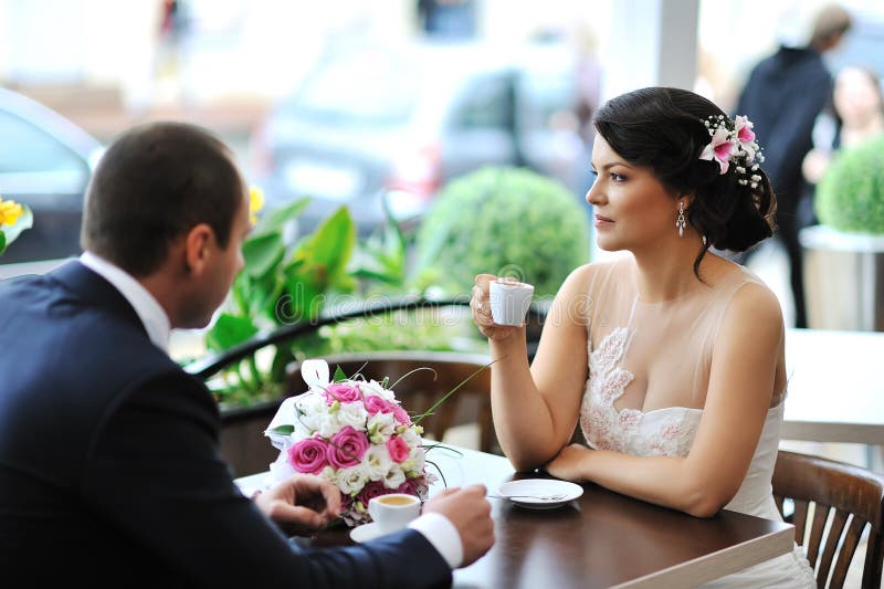Happy Bride and Groom Drinking Coffee at an Outdoor Cafe Stock Photo ...