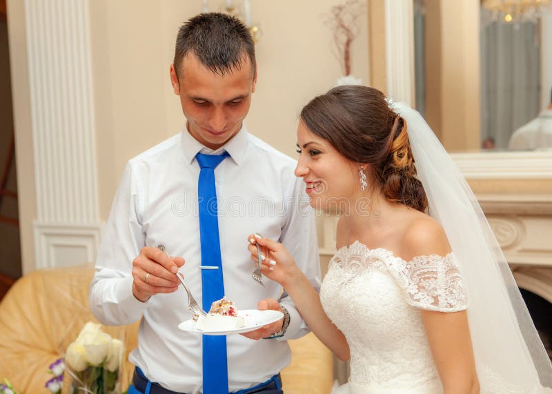 Bride and Groom Eat Wedding Cake Stock Image - Image of beauty ...