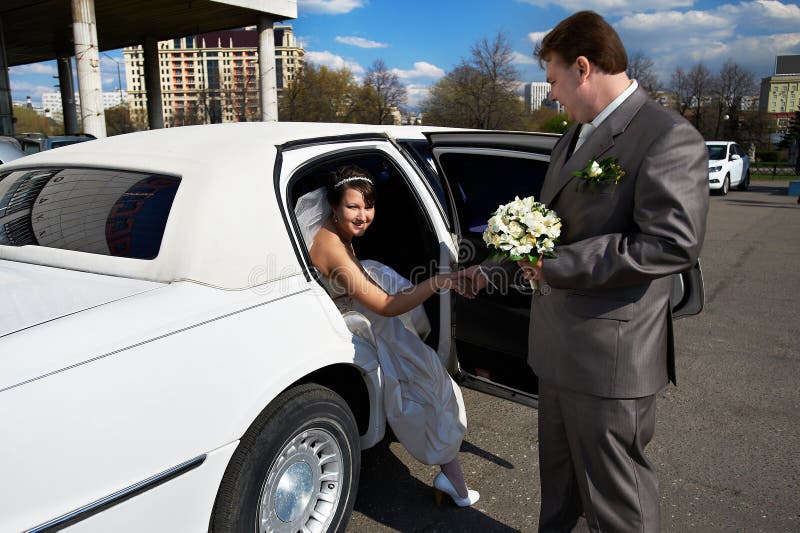 Happy Bride and Groom Out of Wedding Limousine Stock Image - Image of ...