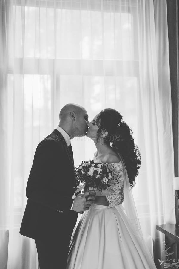 Happy Bride and Groom in a Room Hug Each Other. Stock Image - Image of ...
