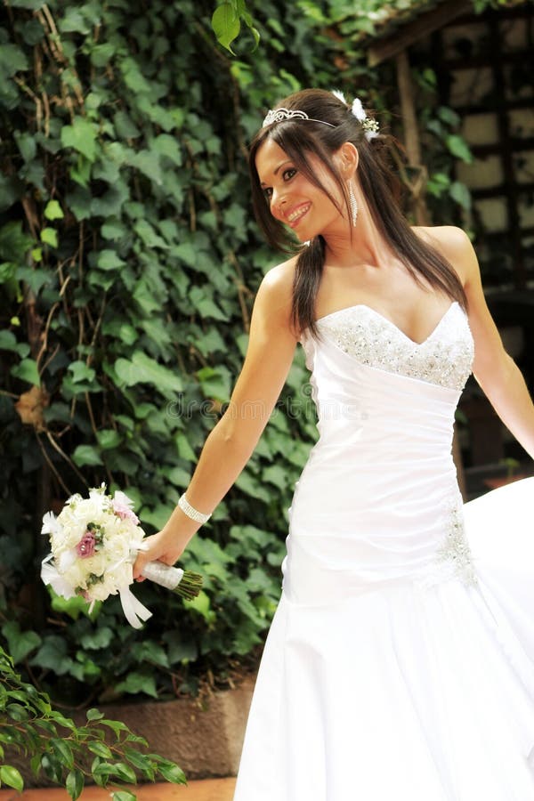 Happy Bride Holding a Bouquet Stock Image - Image of bridal, roses ...