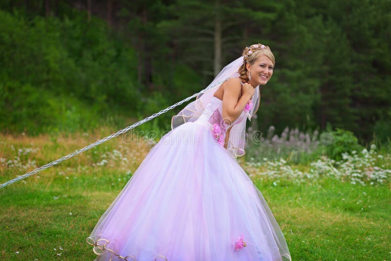 Bride pulls a steel chain stock image. Image of joke - 30285927