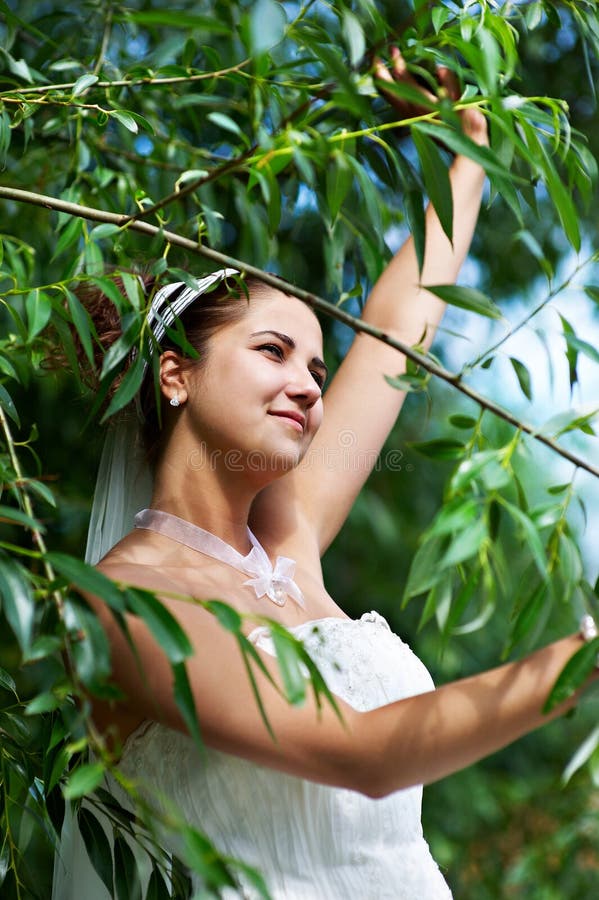 Happy Bride in Wedding Dress and Branch of Tree Stock Photo - Image of ...