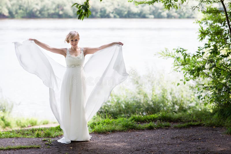 Happy Bride in a Wedding Dress is Spinning. Stock Image - Image of ...