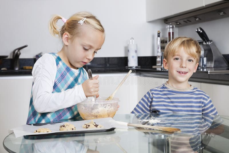 Happy Brother and Sister Baking Cookies in Kitchen Stock Photo - Image ...