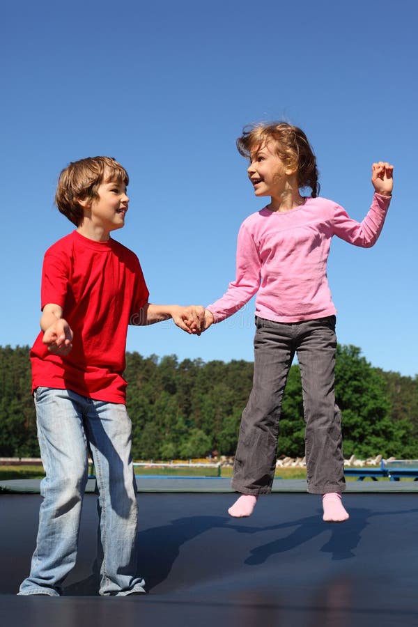 Happy Brother and Sister Jump on Trampoline Stock Image - Image of ...
