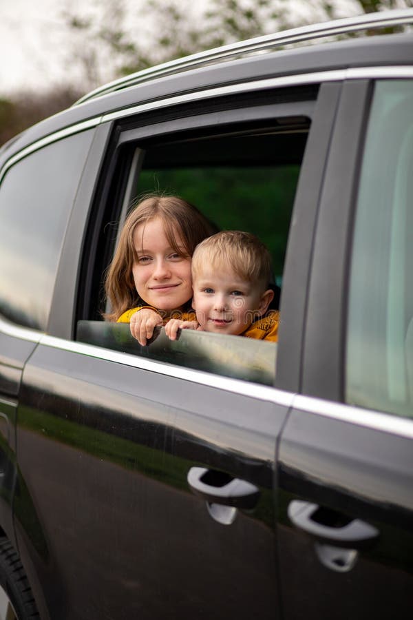 Happy Brother and Sister Looking Out Car Window Stock Photo - Image of ...