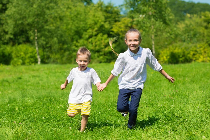 Happy Brother and Sister Running on Grass Stock Image - Image of grass ...