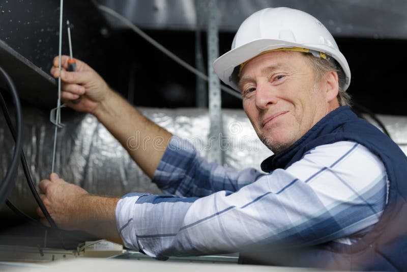 Happy Builder Fixing Wire Issue Stock Image - Image of professional ...