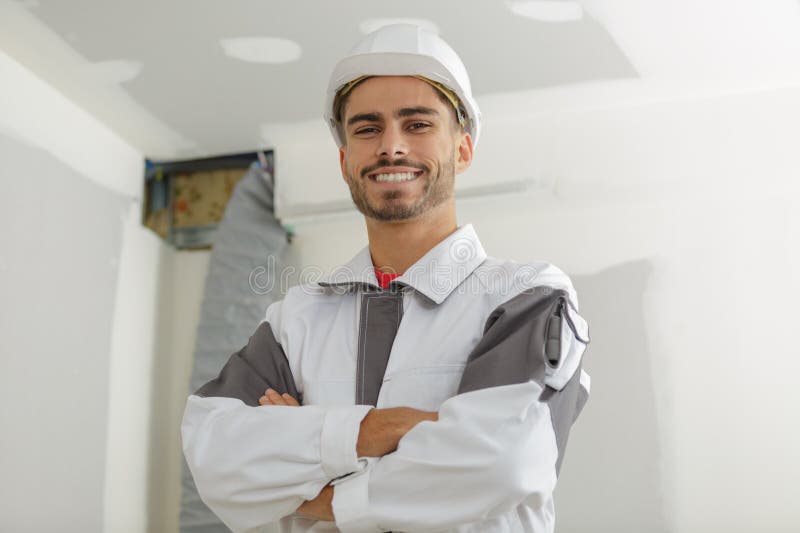 Happy builder in helmet stock photo. Image of handsome - 308543724