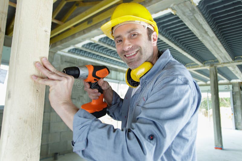 Happy Builder Holding Drill Stock Photo - Image of tool, foreman: 315450362