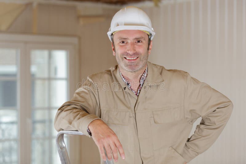 Happy builder on ladder stock image. Image of tool, closeup - 258968067