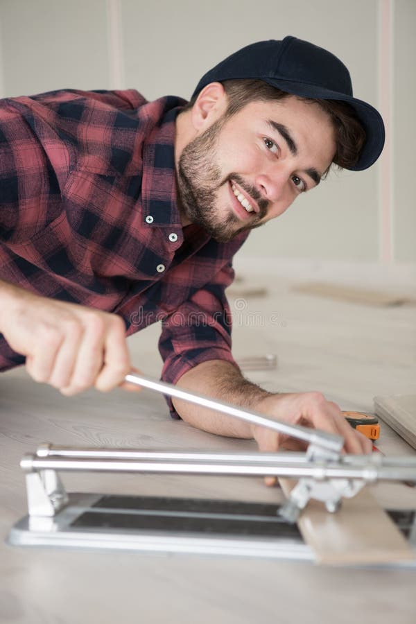 Happy Builder Man Cutting Ceramic Tile Stock Image - Image of design, material: 263894173