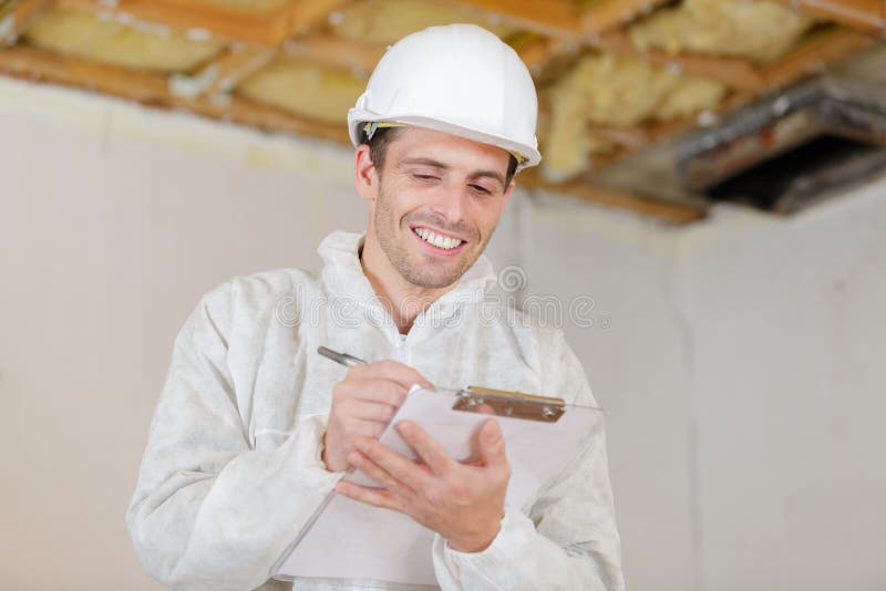Happy Builder Pointing Finger and Holding Clipboard Stock Image - Image ...