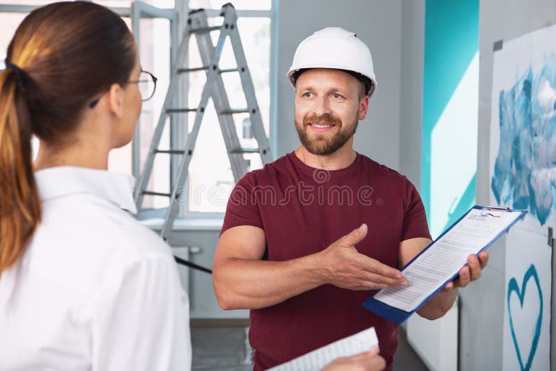 Happy Builder Showing the Contract To His Client Stock Image - Image of ...